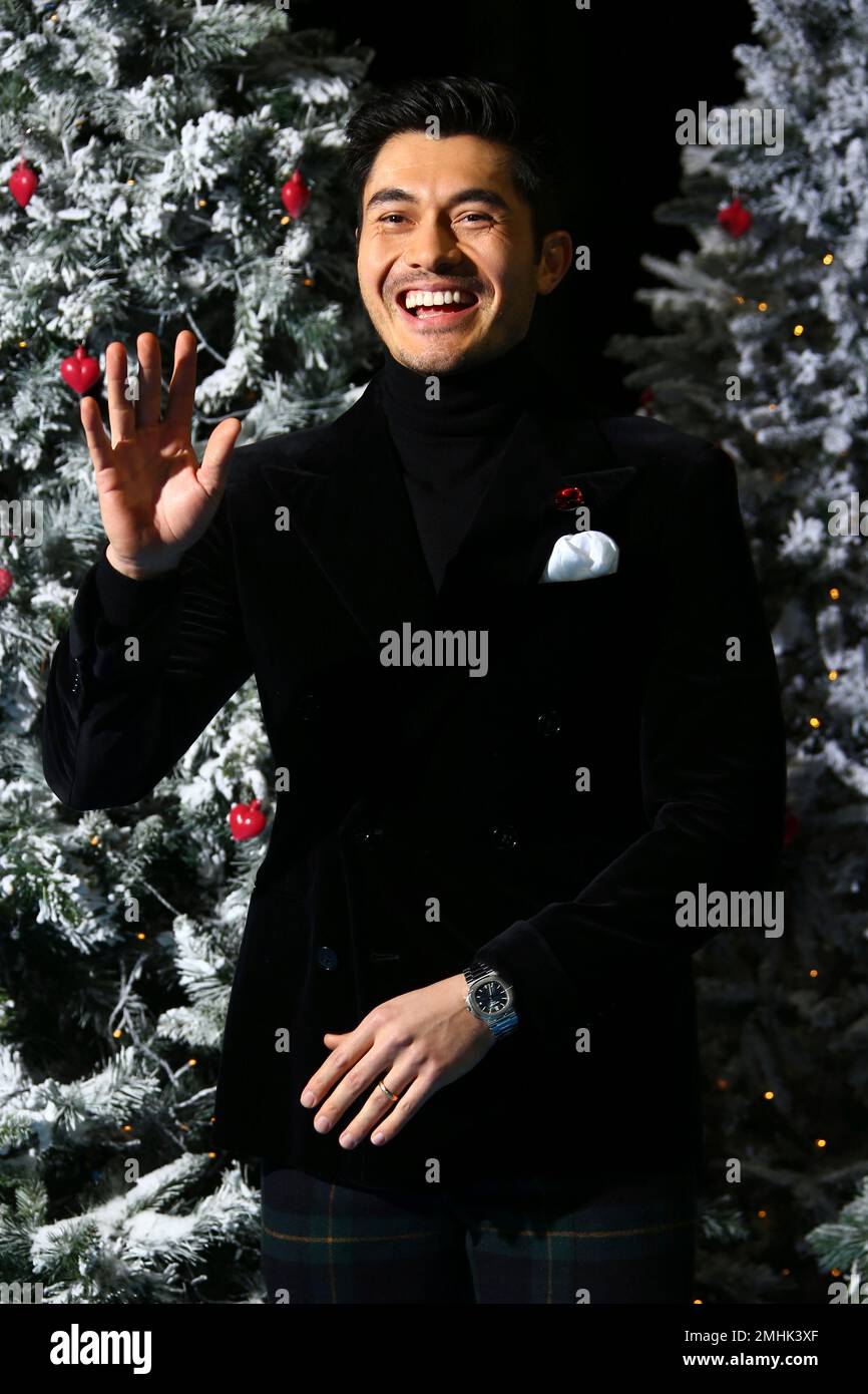Actor Henry Golding poses for photographers upon arrival at the ...
