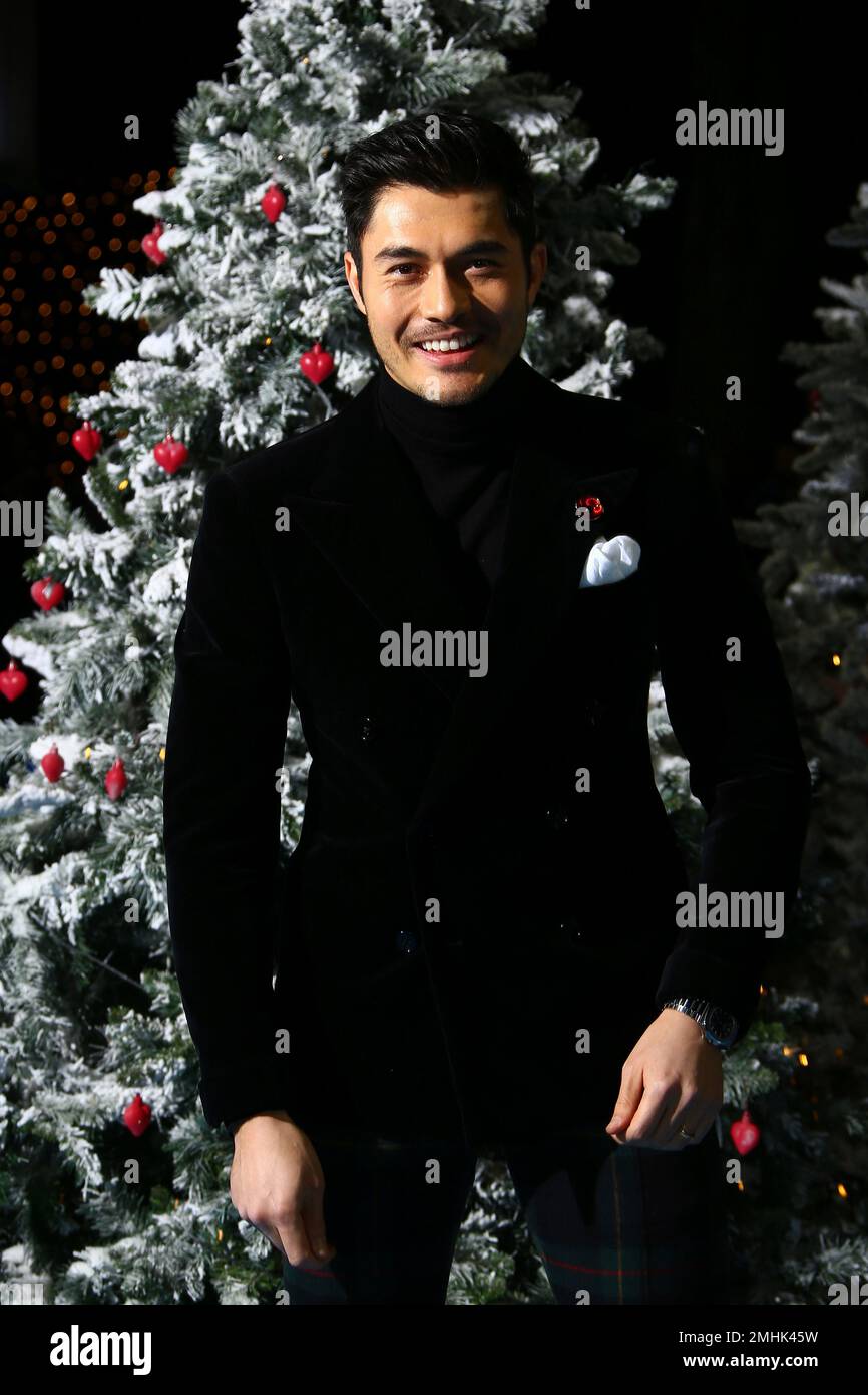Actor Henry Golding poses for photographers upon arrival at the ...