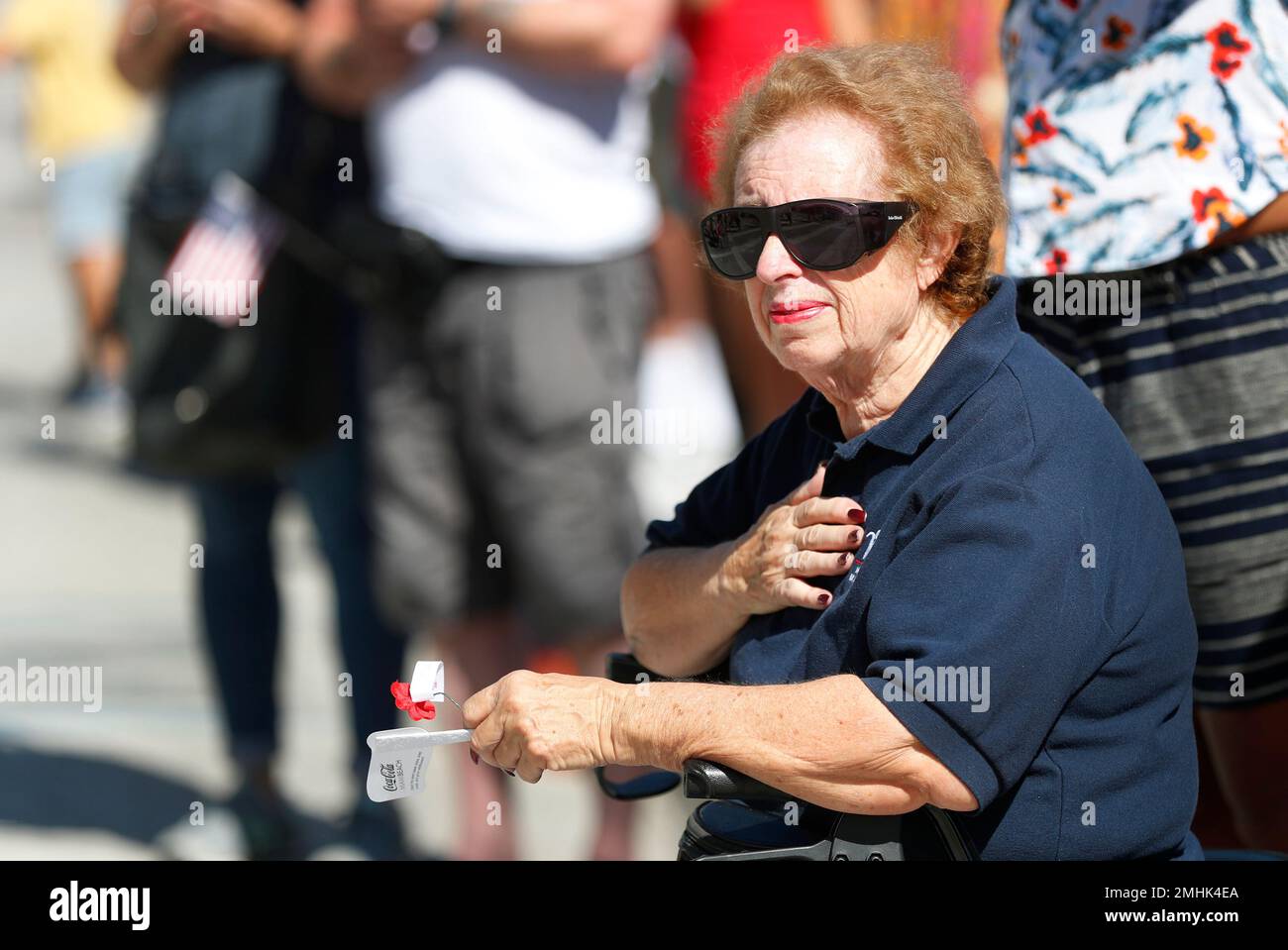Lea Rosenberg, 75, of Miami Beach, Fla., holds her hand to her heart as ...
