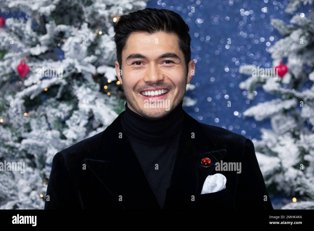 Actor Henry Golding poses for photographers upon arrival at the ...