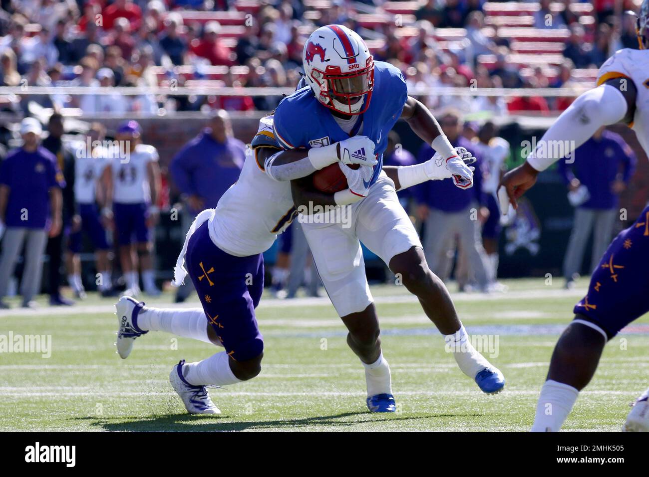 SMU wide receiver Rashee Rice, right, is tackled by East Carolina ...