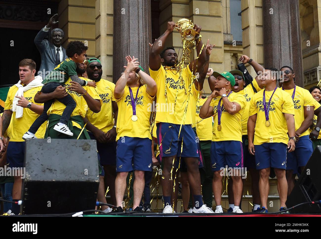 The South Africa Springbok rugby team celebrate with the trophy in ...