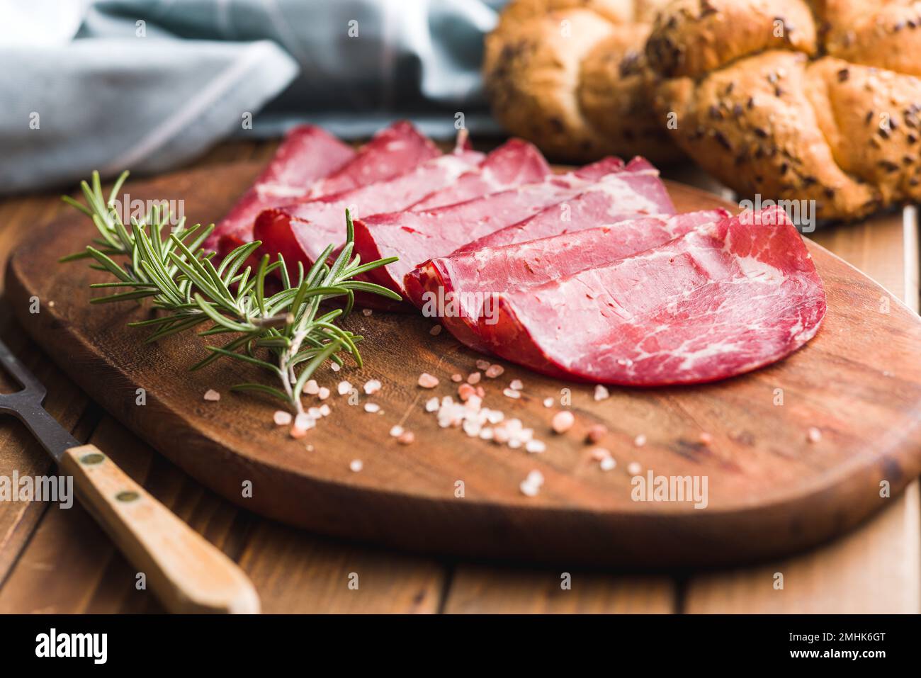 Smoked bresaola. Italian appetizer. Dried beef meat on the cutting ...
