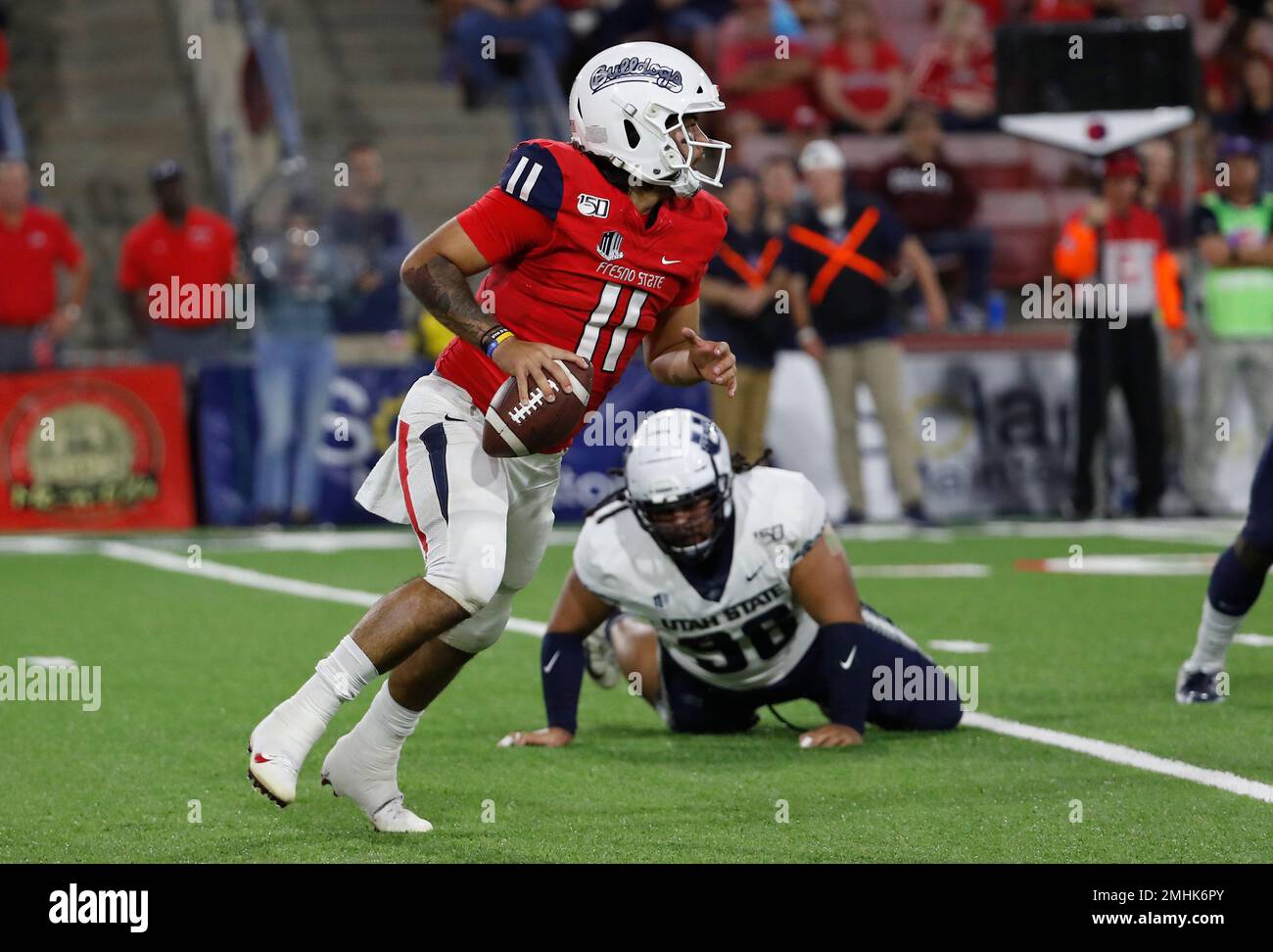 Fresno State quarterback Jorge Reyna scrambles against Utah State ...