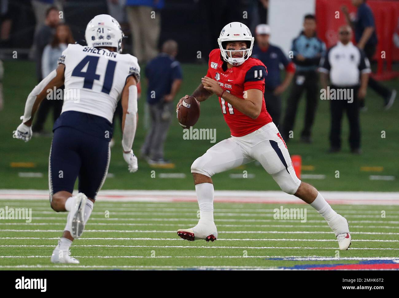 Fresno State quarterback Jorge Reyna looks to pass against Utah State ...