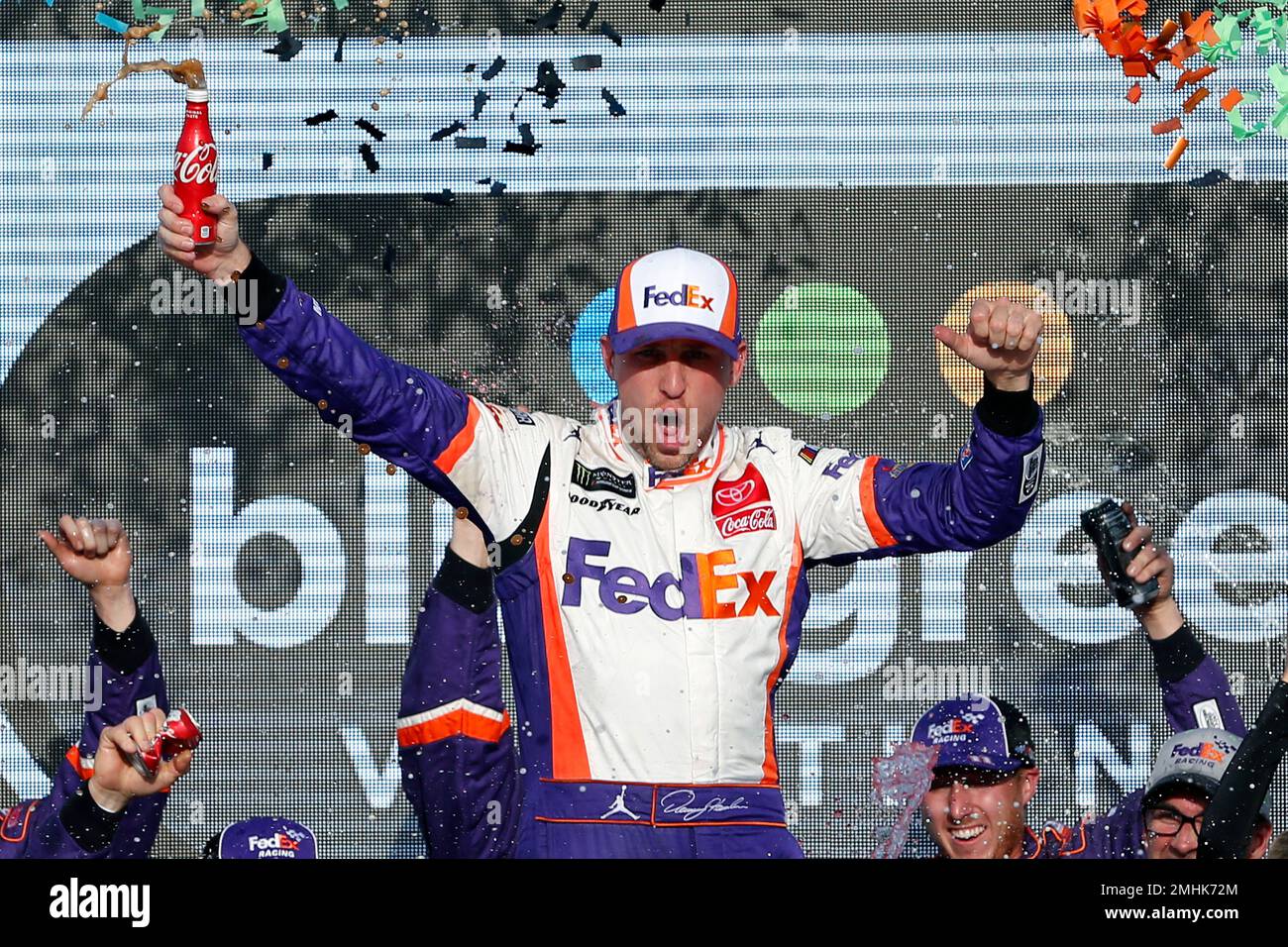 Denny Hamlin celebrates in victory lane after winning the NASCAR Cup ...