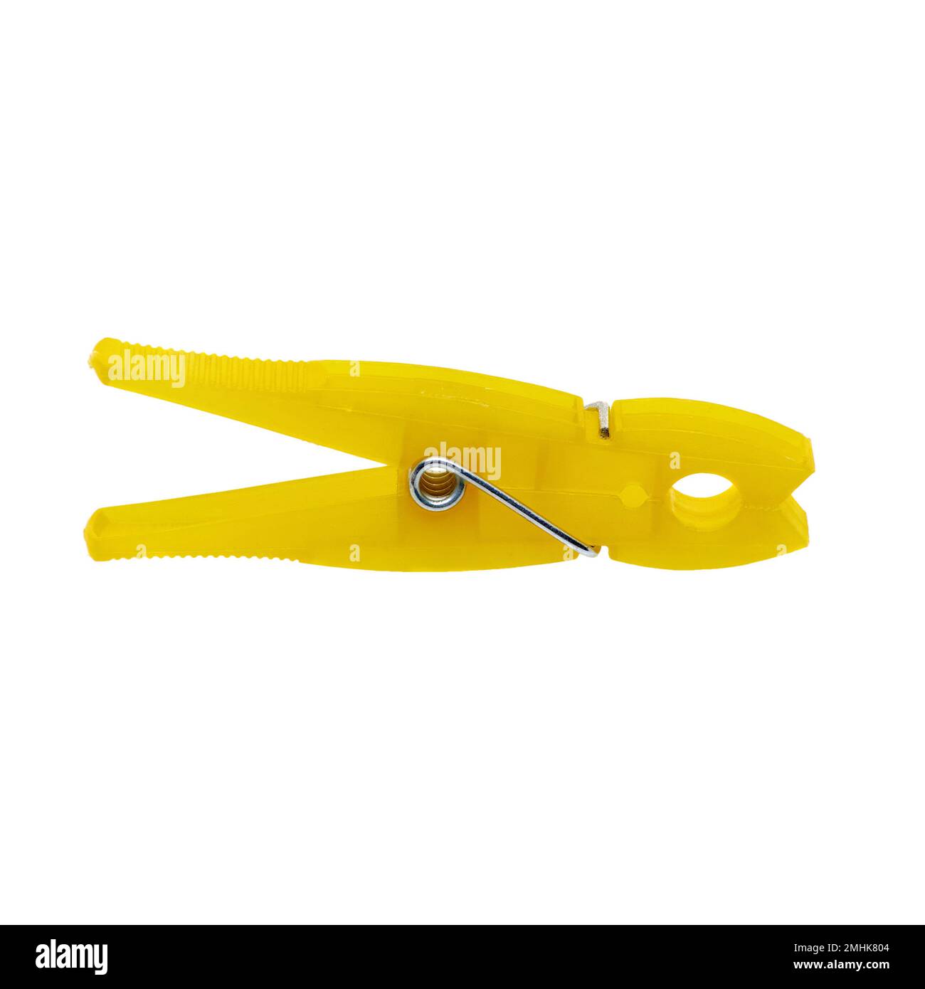 Image of a yellow clothespin with a steel spring on a white background ...