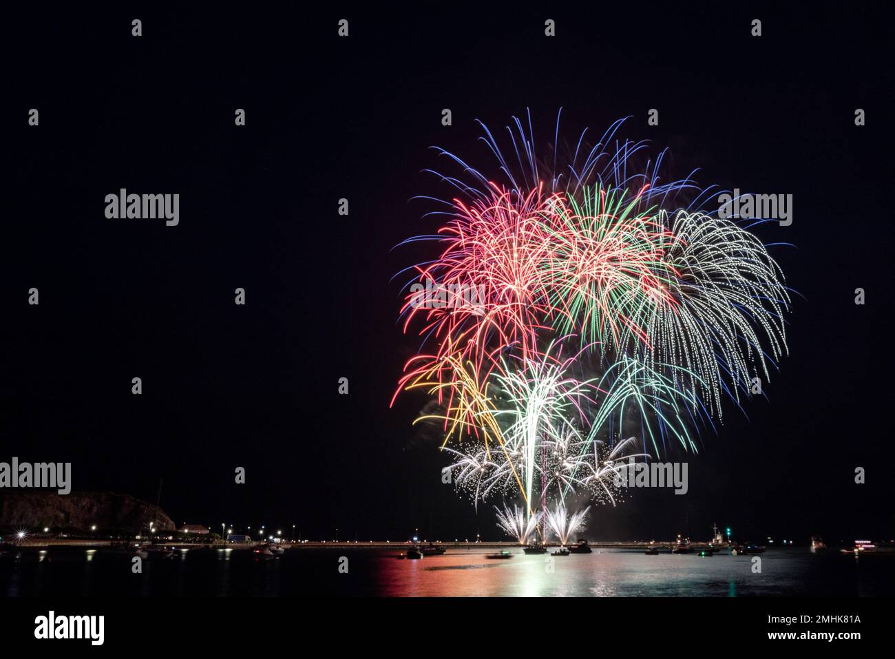 Firework explosions over the harbour from The Queen Annes Battery as ...