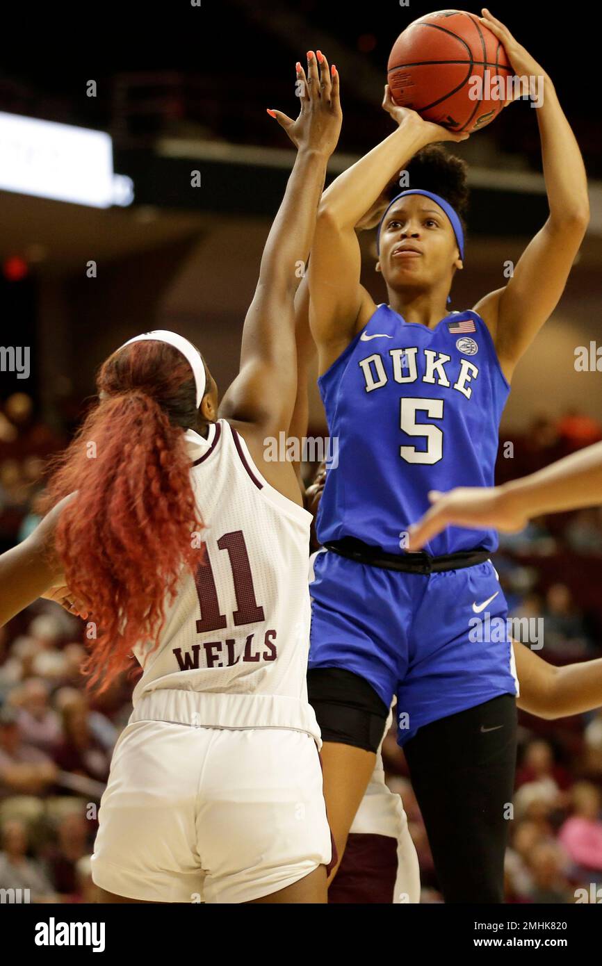 Duke forward Leaonna Odom (5) shoots over Texas A&M guard Kayla Wells ...