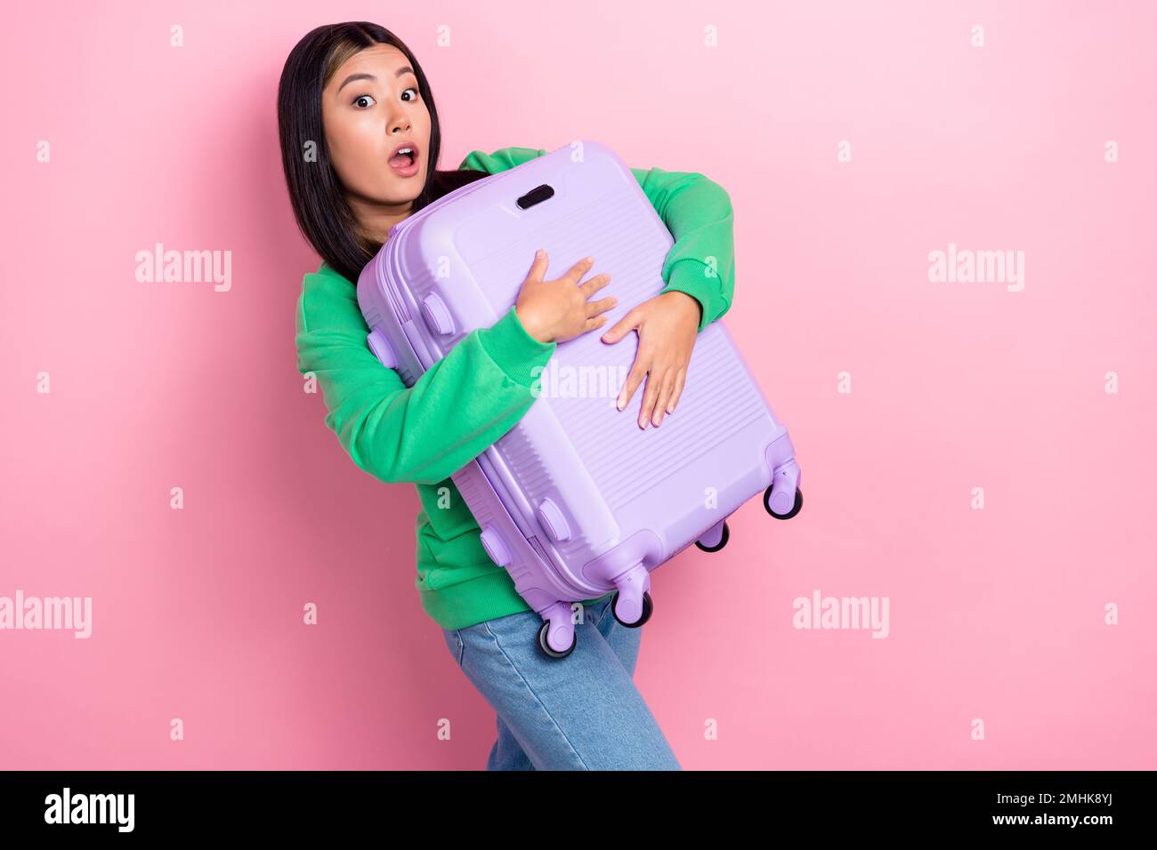 Photo of cheerful shocked lady wear green sweatshirt carrying heavy ...
