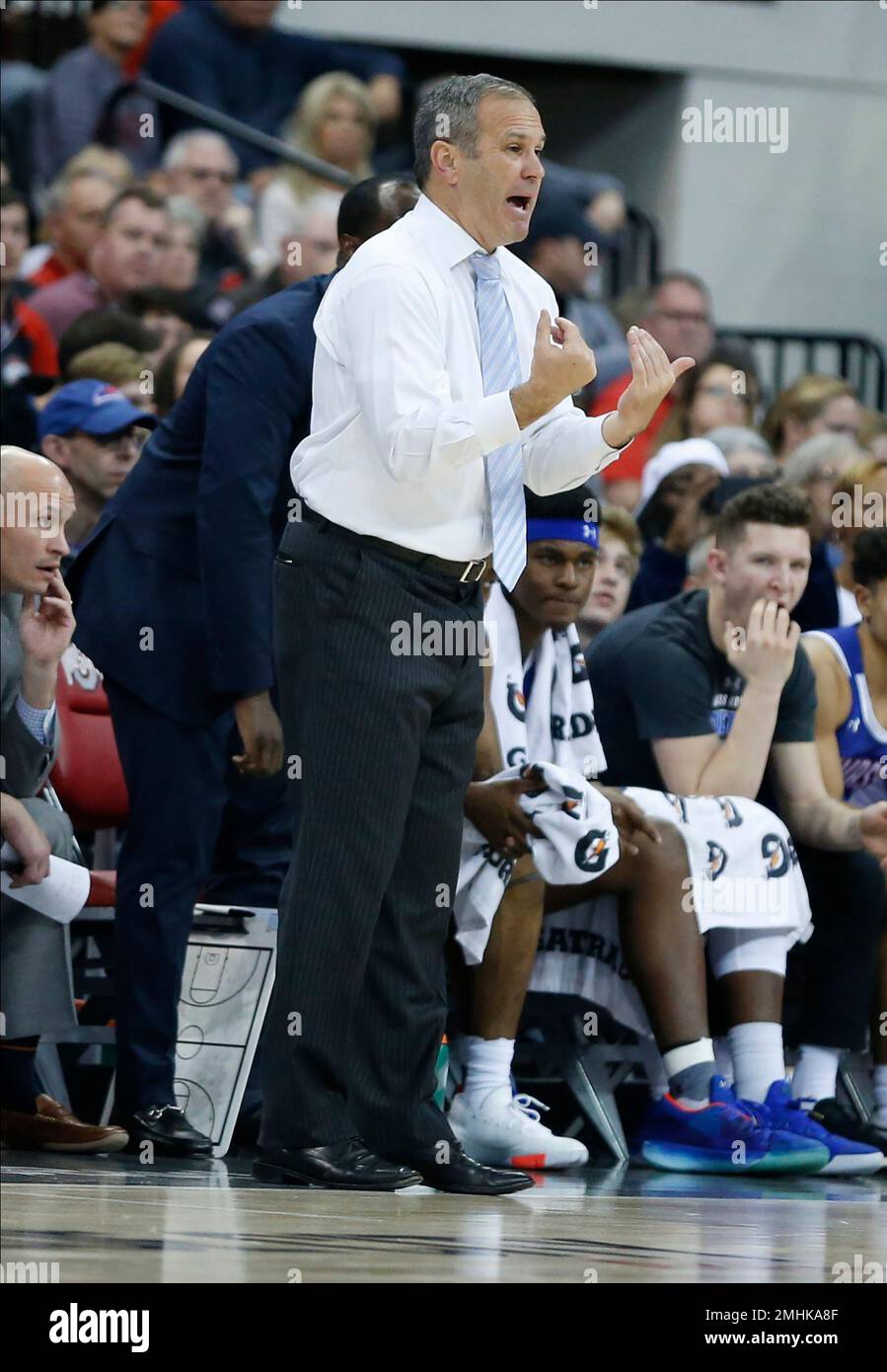 UMass-Lowell head coach Pat Duquette shouts to his team during the ...