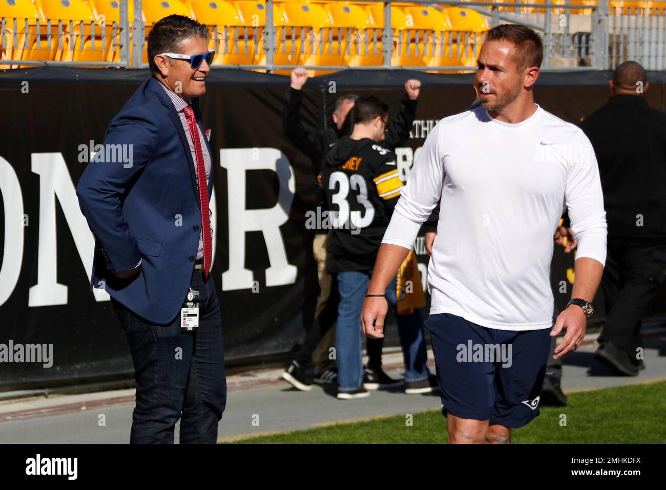 NFLN reporter Omar Ruiz, left, takes with Los Angeles Rams' strength ...