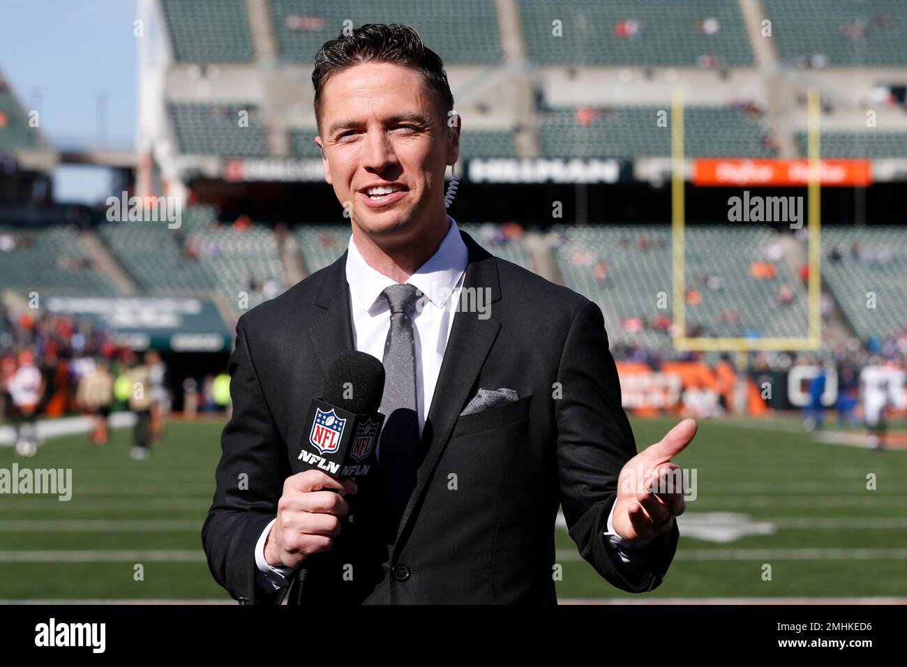Nfl Reporter Tom Pelissero Works The Field During Practice Before An