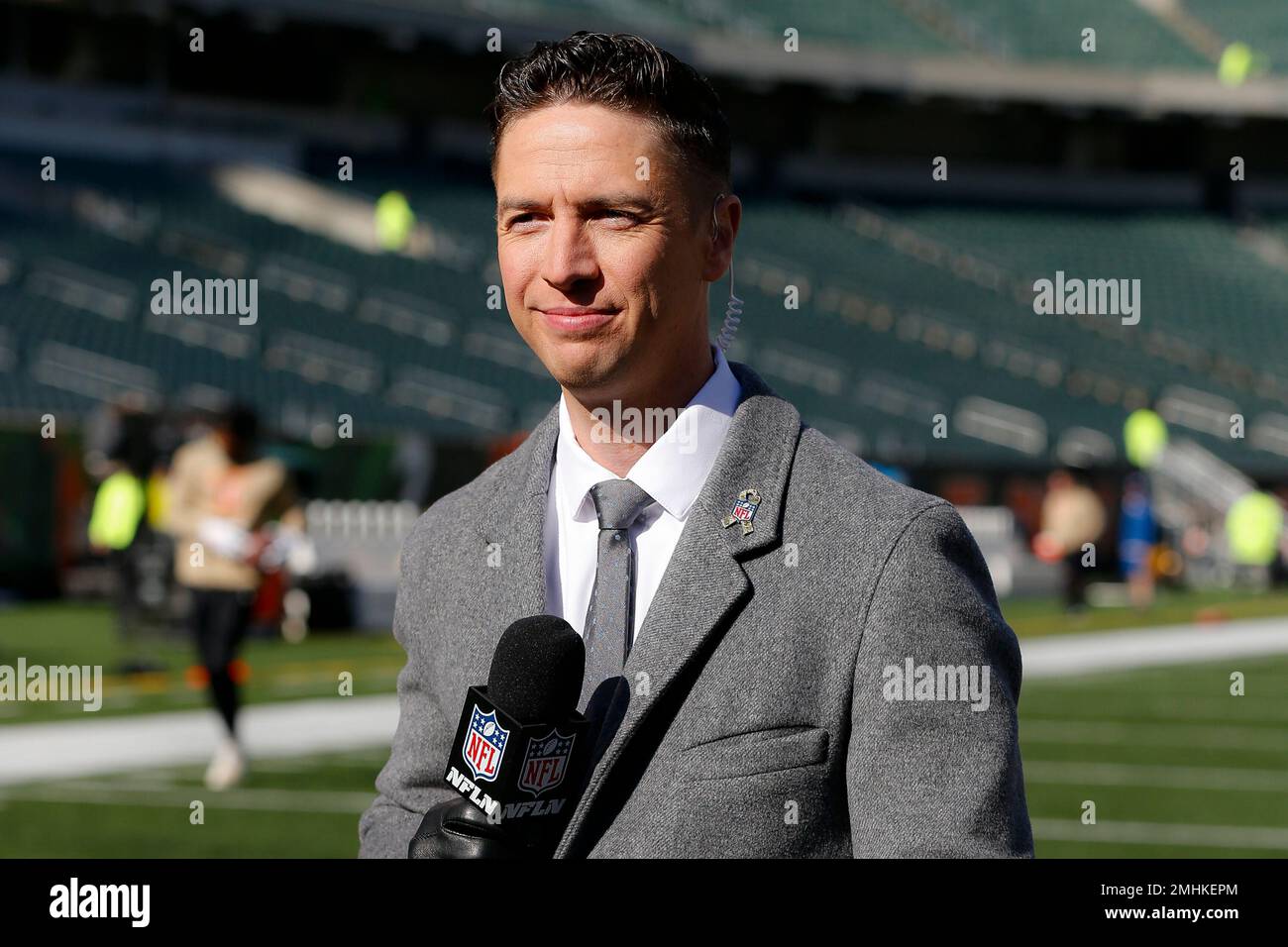 Nfl Reporter Tom Pelissero Works The Field During Practice Before An