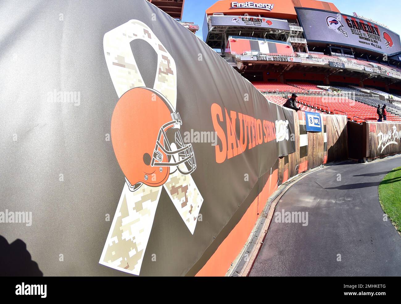 The "Salute to Service" signage is shown before an NFL football game ...