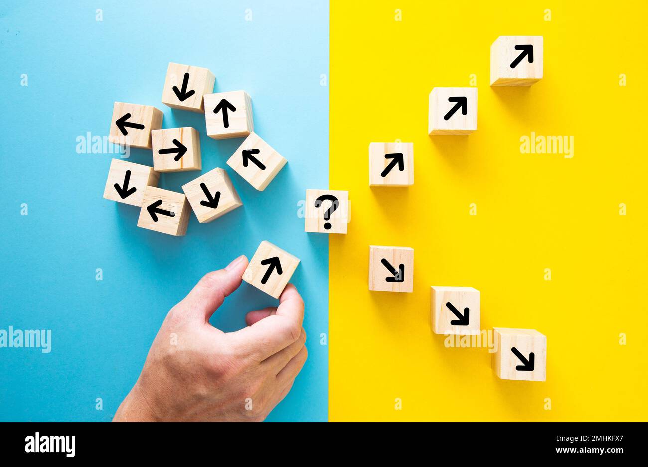 Hand choosing a block with arrows. Path leads to successful decision ...