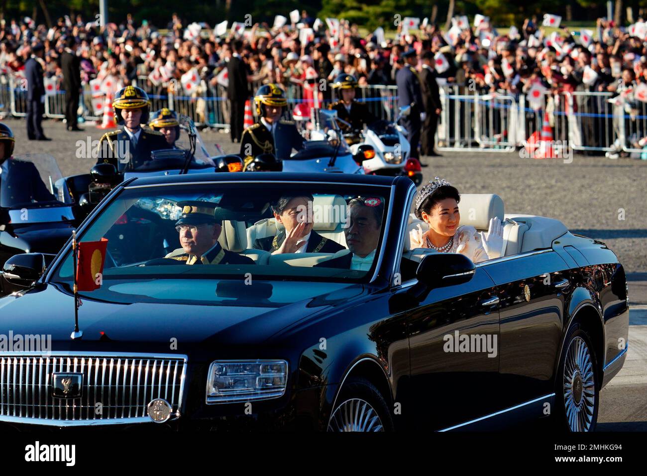 Japanese Emperor Naruhito, center, and Empress Masako, right, smiles ...