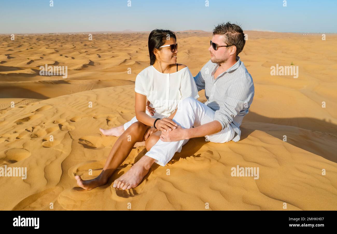 Couple on a Safari trip to the Sand dunes of Dubai United Arab Emirates ...