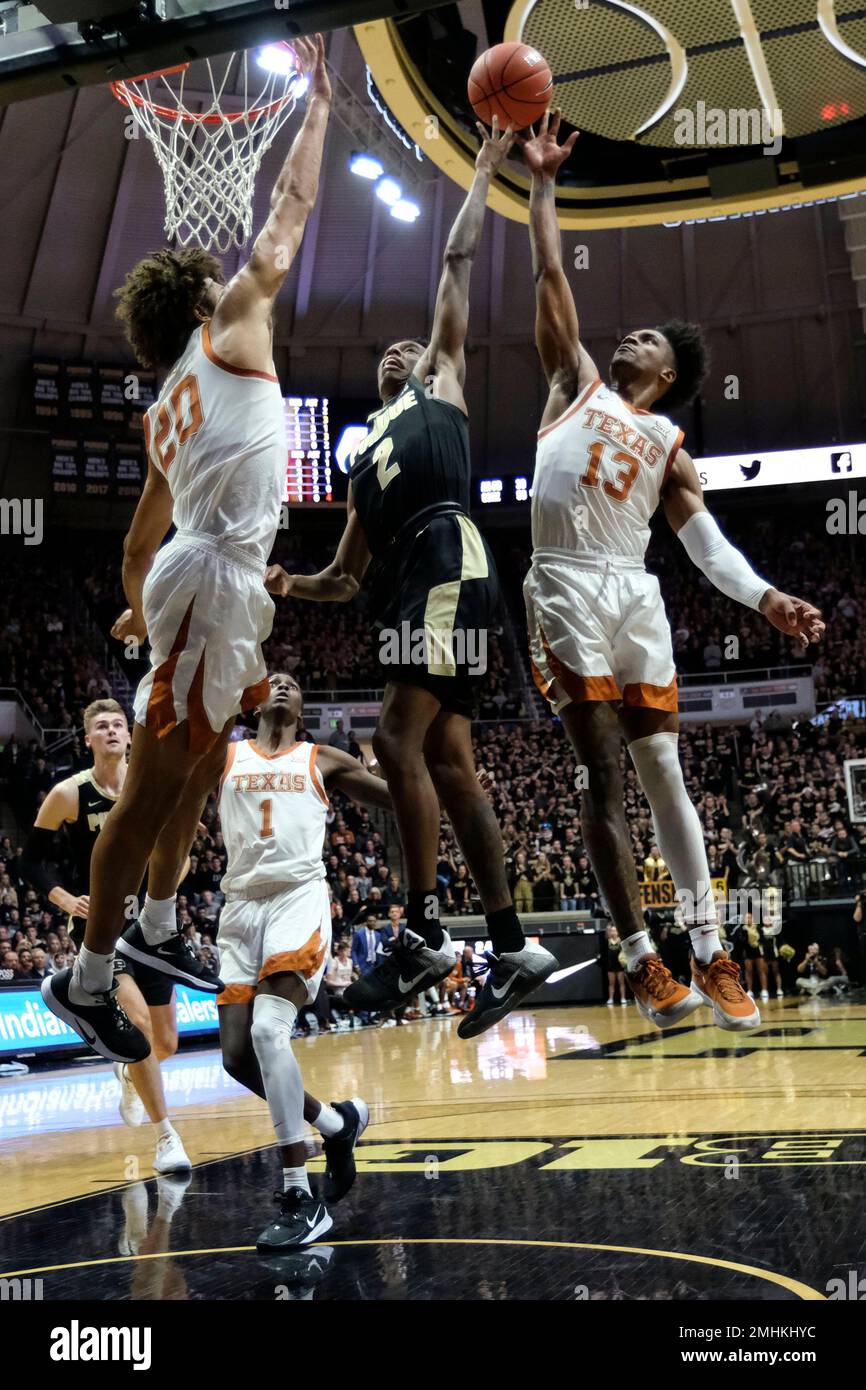 Purdue guard Eric Hunter Jr. (2) shoots in front of Texas guard Jase ...