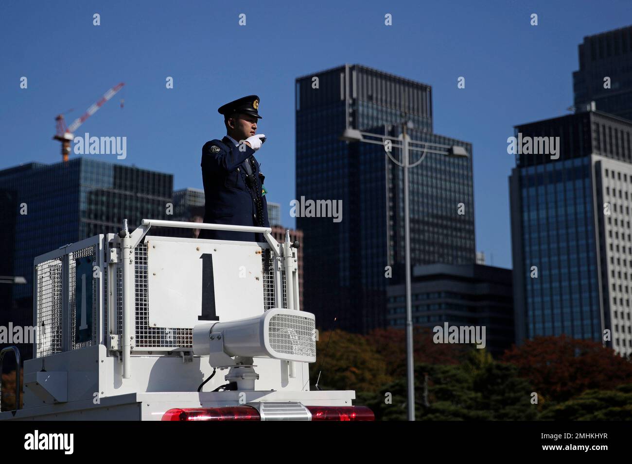 A police officer stands guard outside the Imperial Palace before the ...