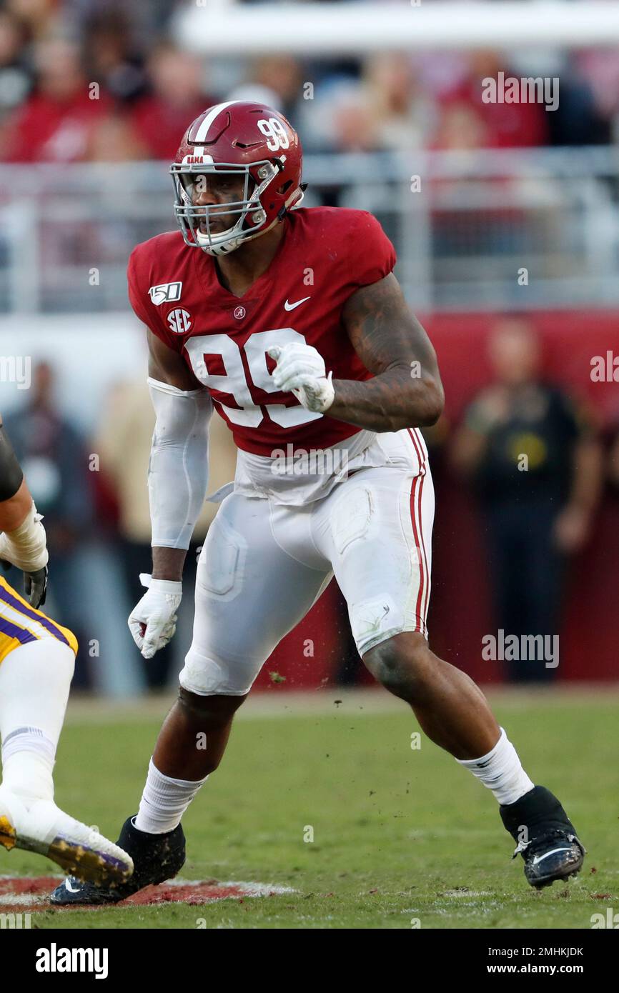 Alabama defensive lineman Raekwon Davis (99) rushes the quarterback in ...