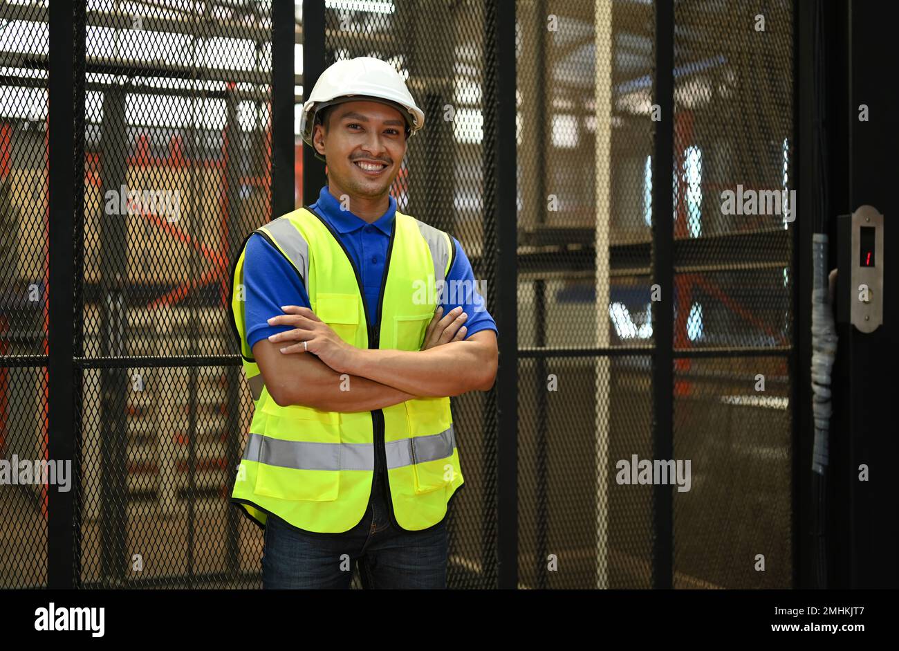 Portrait warehouse team standing arms hi-res stock photography and ...