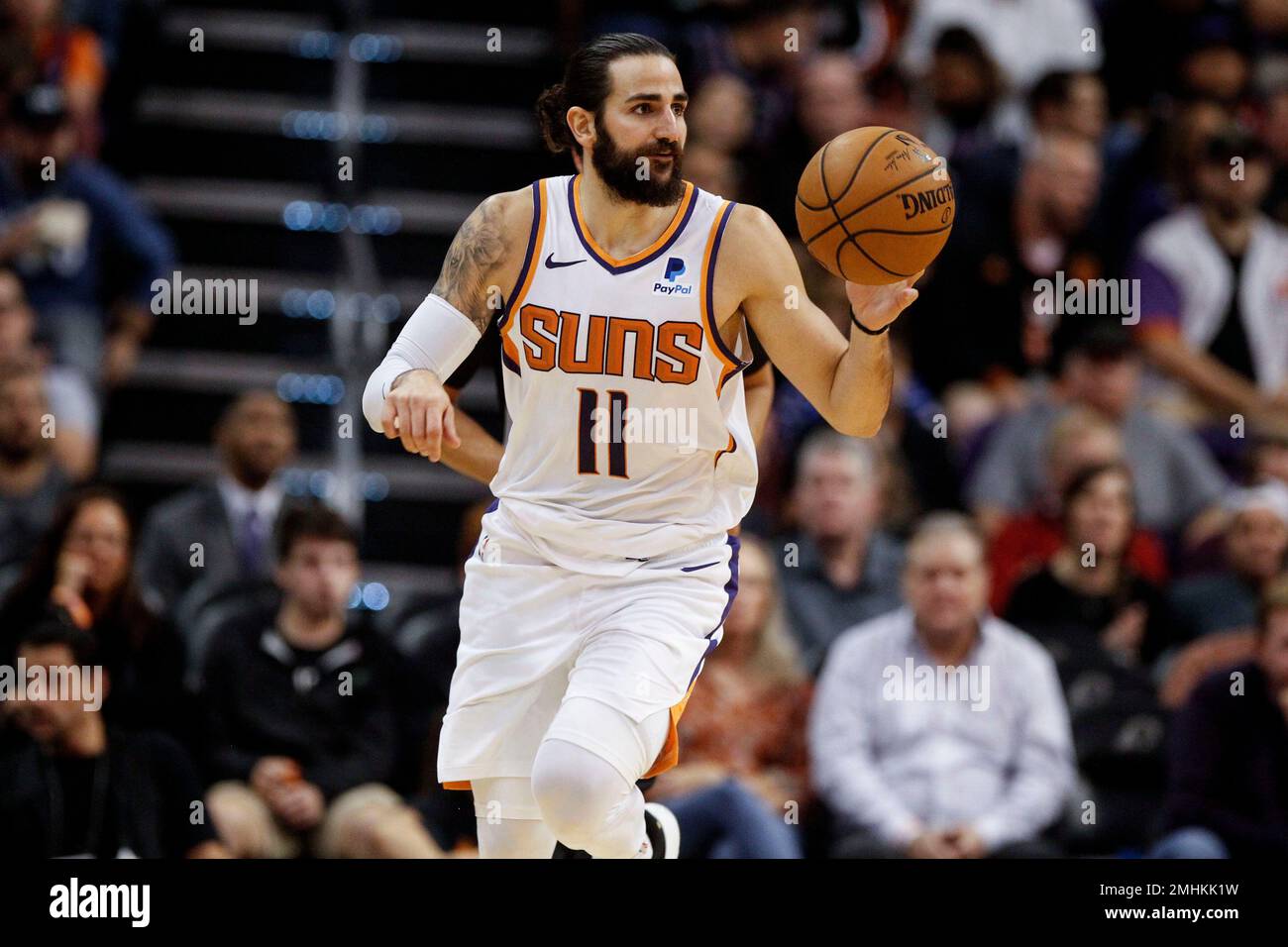 Phoenix Suns' Ricky Rubio (11) brings the ball up the court against ...