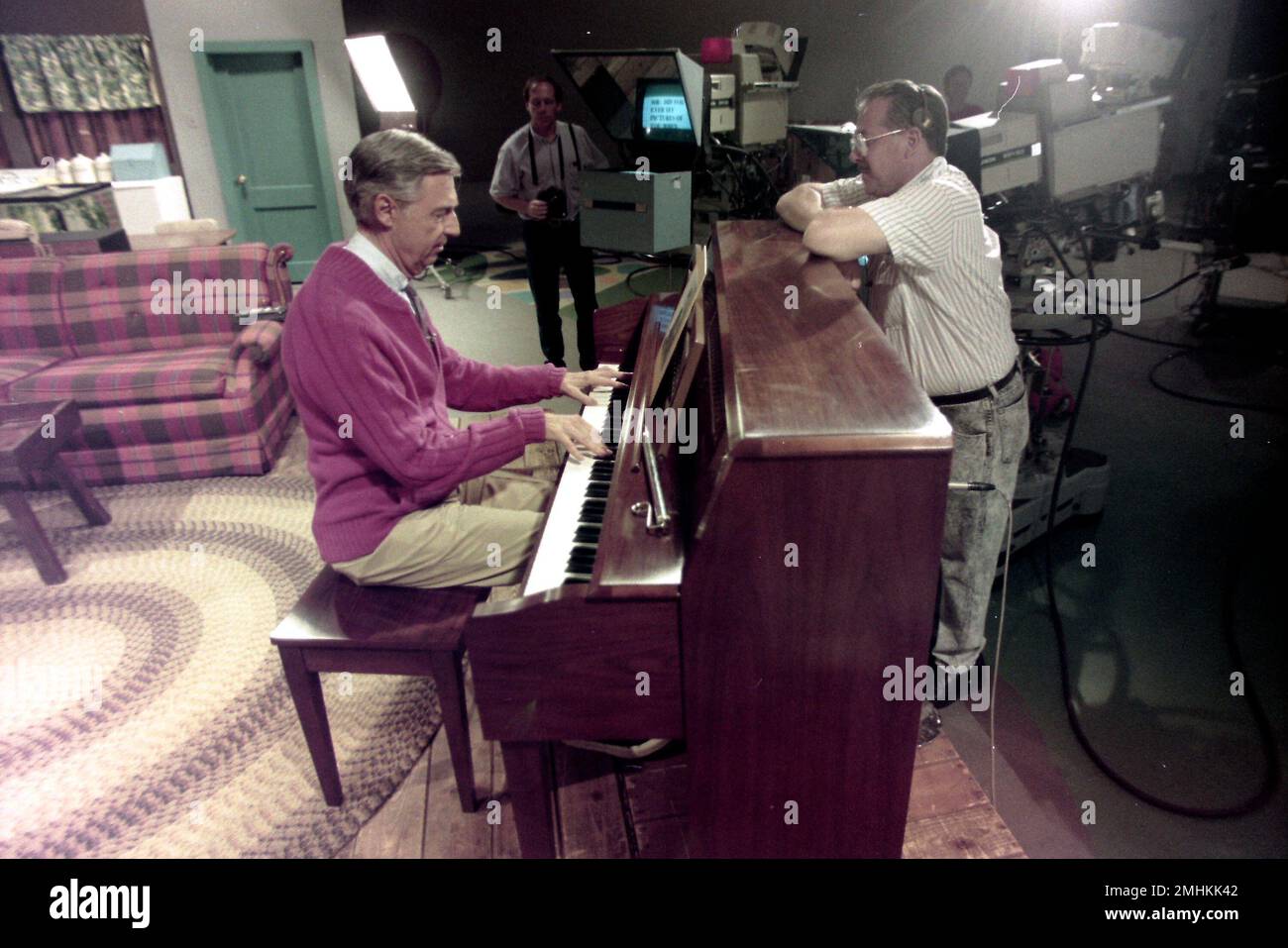 This June 8, 1993 file photo shows Fred Rogers playing piano between ...