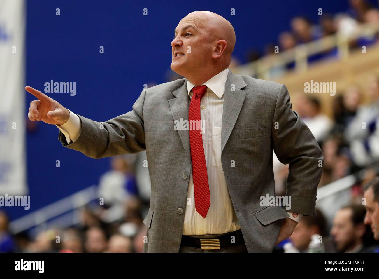 Stony Brook head coach Geno Ford directs his team against Seton Hall ...