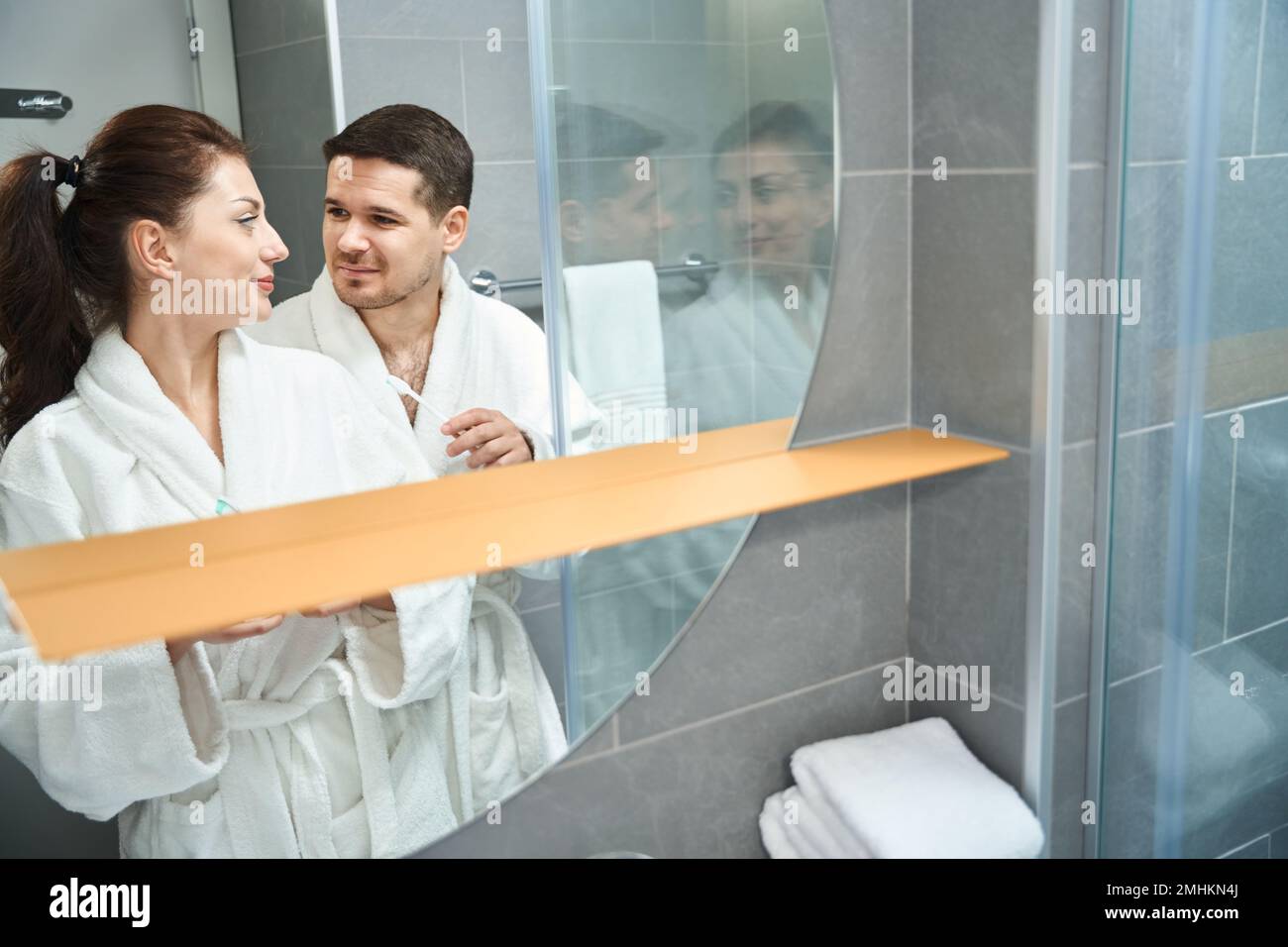 Young couple doing their morning routine in the bathroom Stock Photo ...
