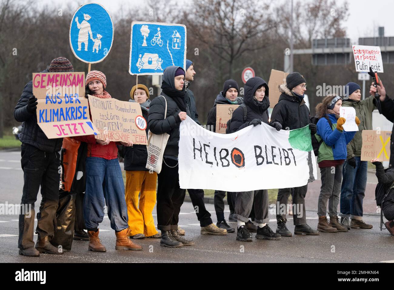 Dresden, Germany. 27th Jan, 2023. Environmental activists stand on the ...