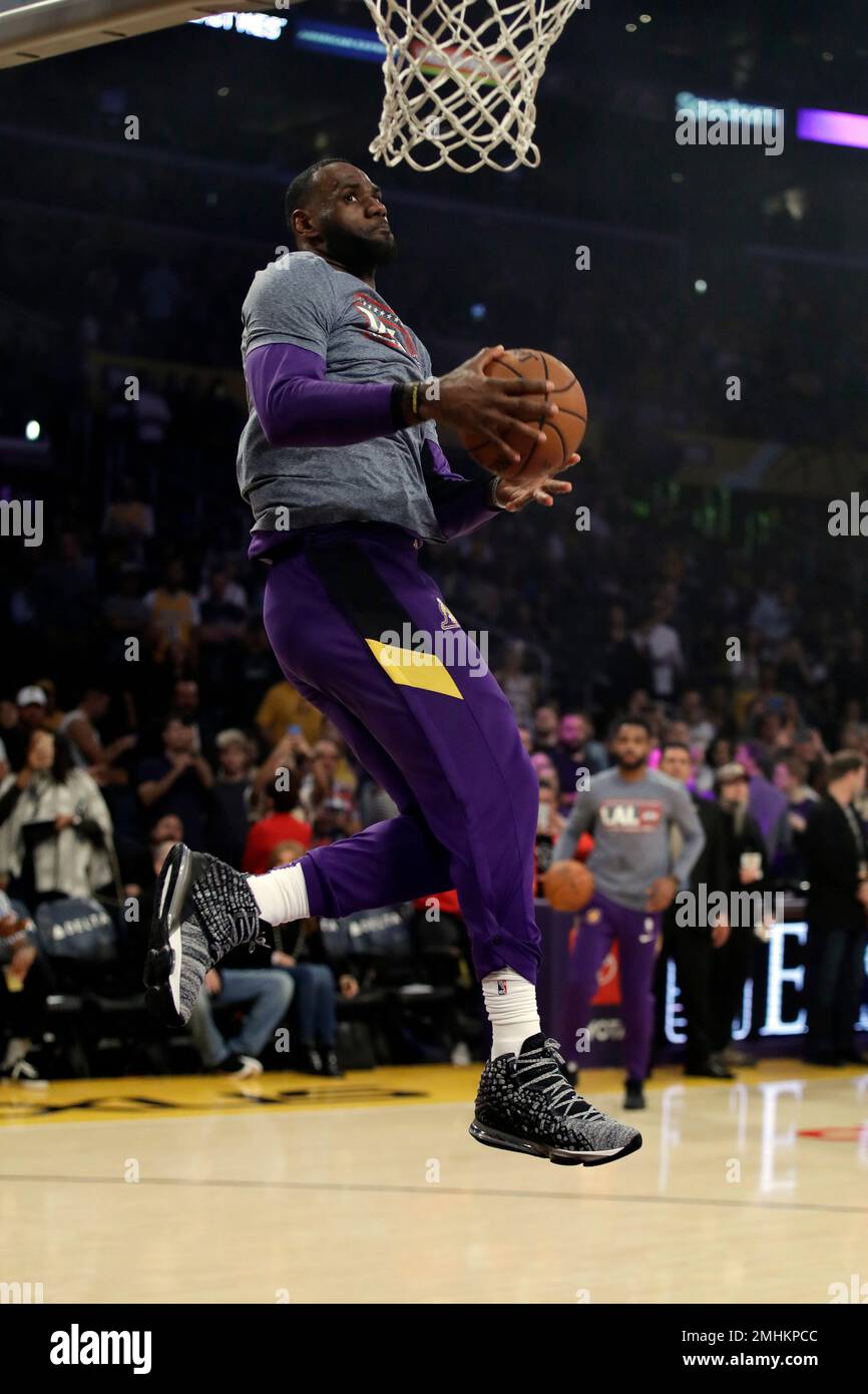 Los Angeles Lakers' LeBron James warms up before an NBA basketball game ...