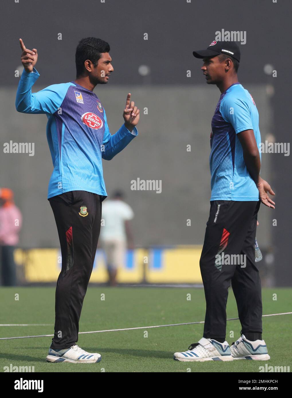 Bangladeshi captain Mahmudullah, left, speaks with Mustafizur Rahman ...