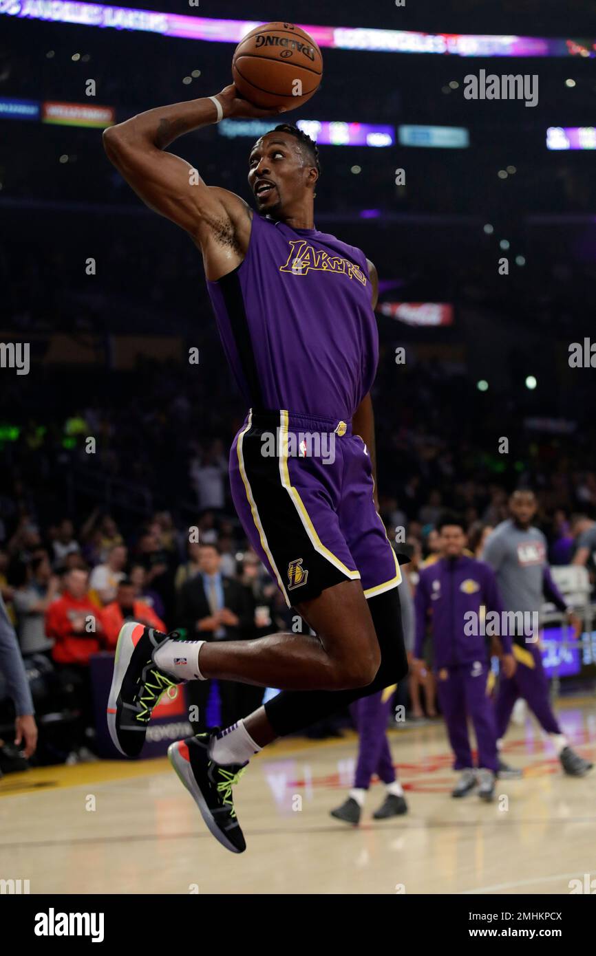Los Angeles Lakers' Dwight Howard warms up before an NBA basketball ...
