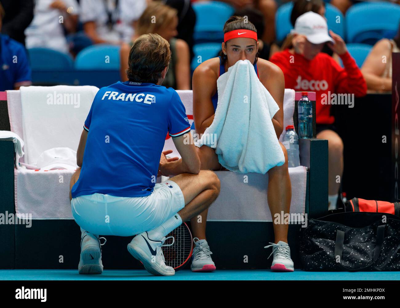 French Captain Julien Benneteau consoles Caroline Garcia as she ...