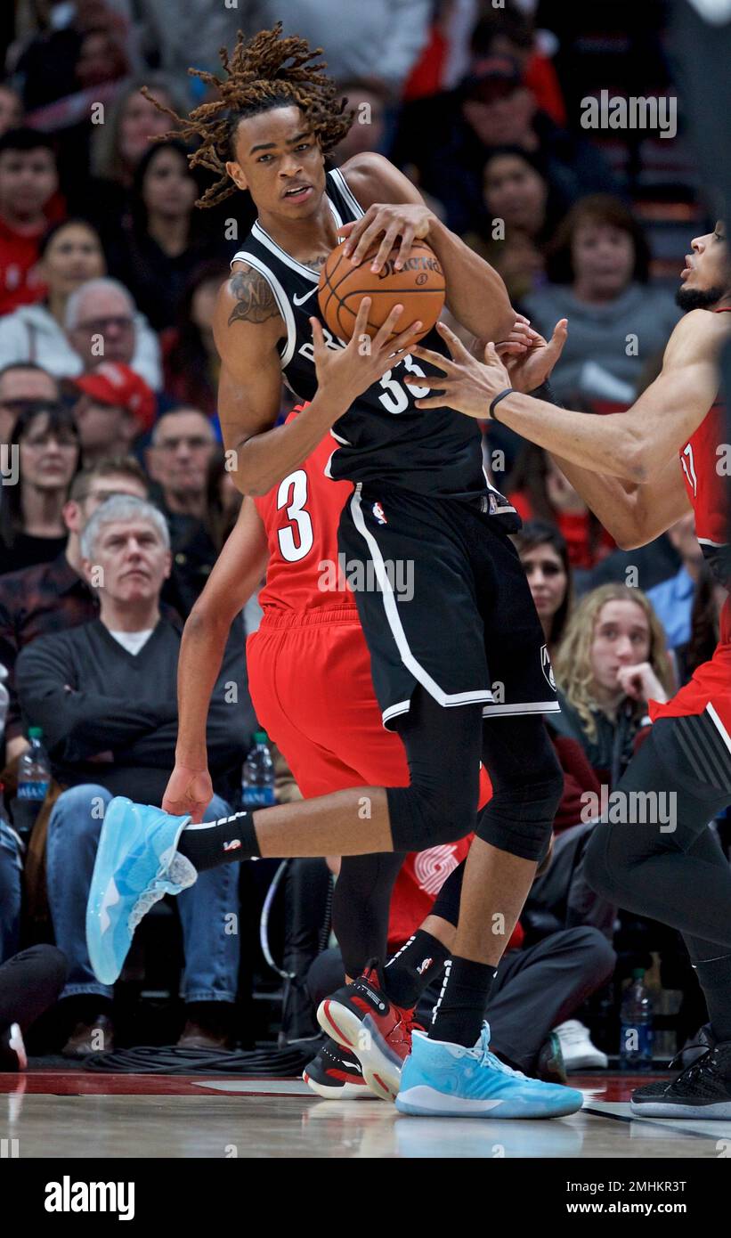 Brooklyn Nets forward Nicolas Claxton, left, rebounds the ball in front ...