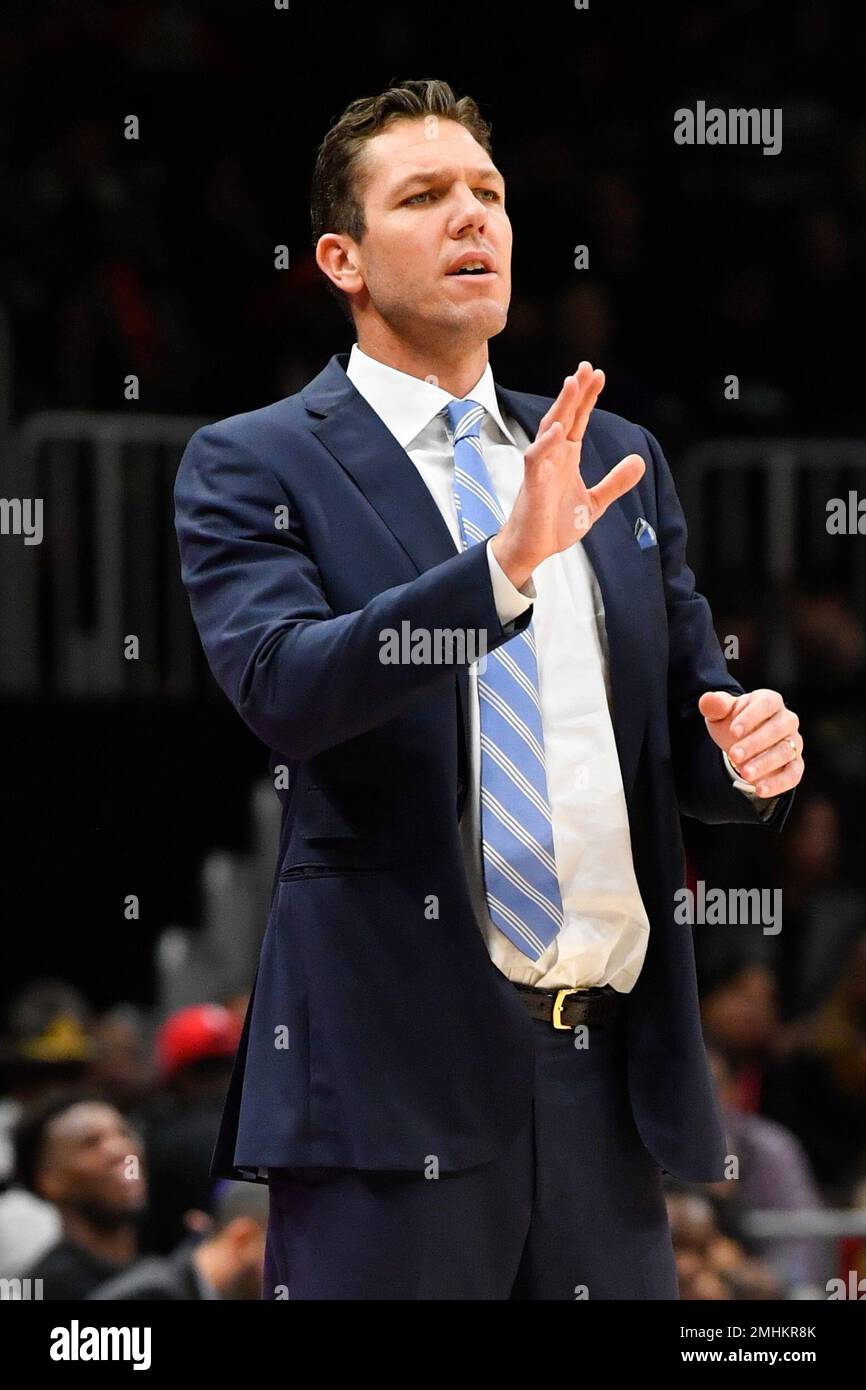 Sacramento Kings coach Luke Walton motions to players during the second ...