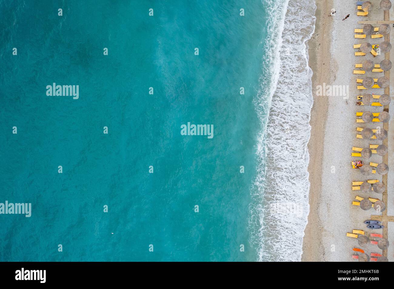 Straight down view on parasols and beach by Bunec Beach area in Summer ...