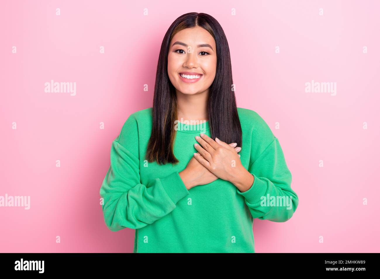 Photo of dreamy shiny young lady wear green sweatshirt arms heart ...