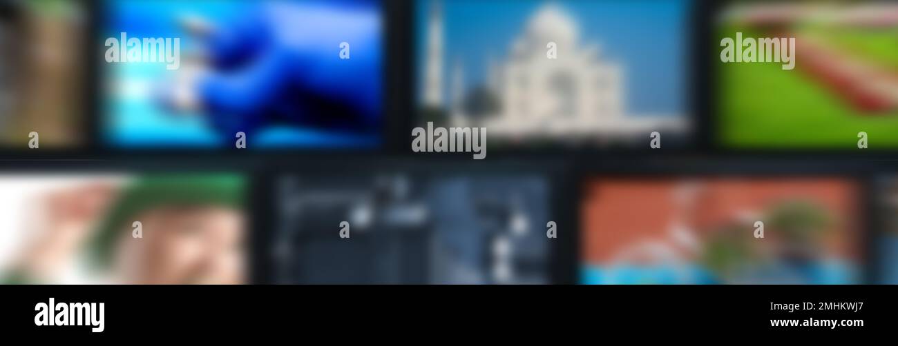 Background of many blurred TV screens. Master control room of TV ...