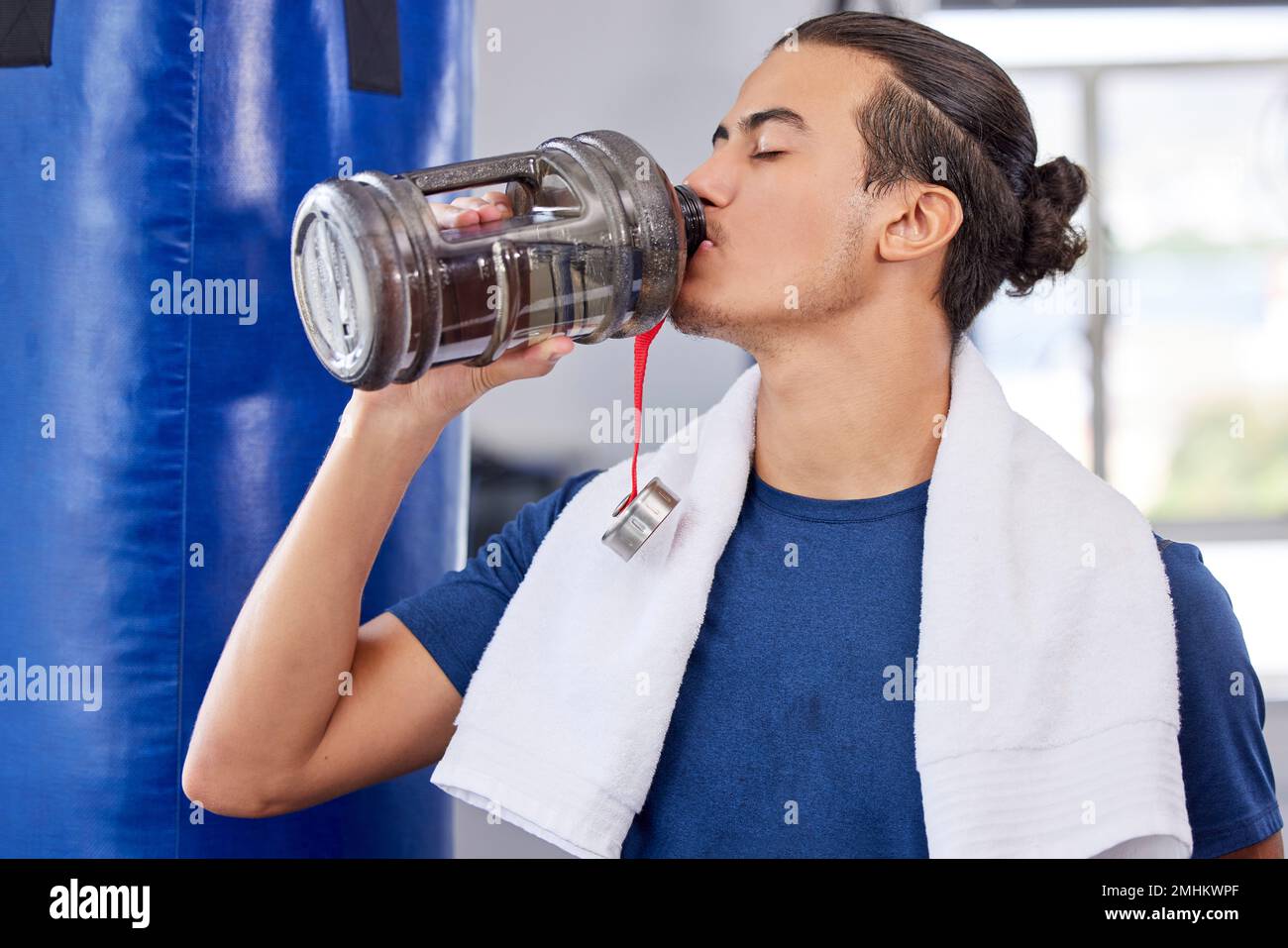 Fitness, man and drinking water in gym for health, rest and energy for ...