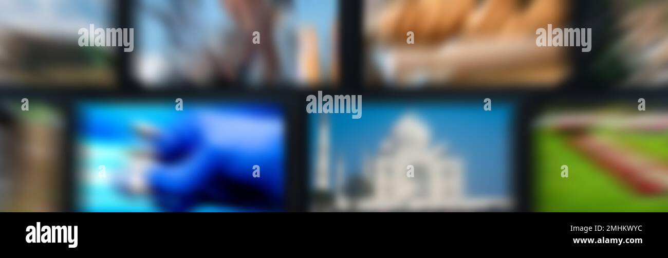 Background of many blurred TV screens. Master control room of TV ...