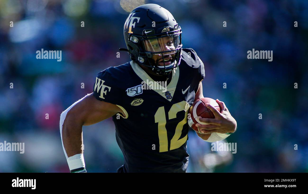 Wake Forest quarterback Jamie Newman (12) runs for a touchdown against ...