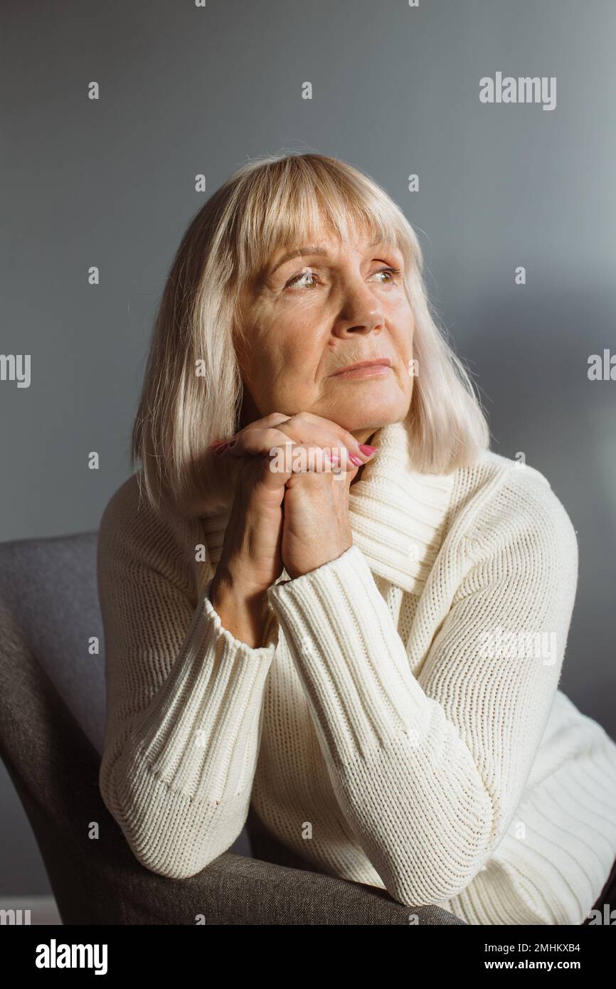 Pretty mid age woman relaxing at home Stock Photo - Alamy