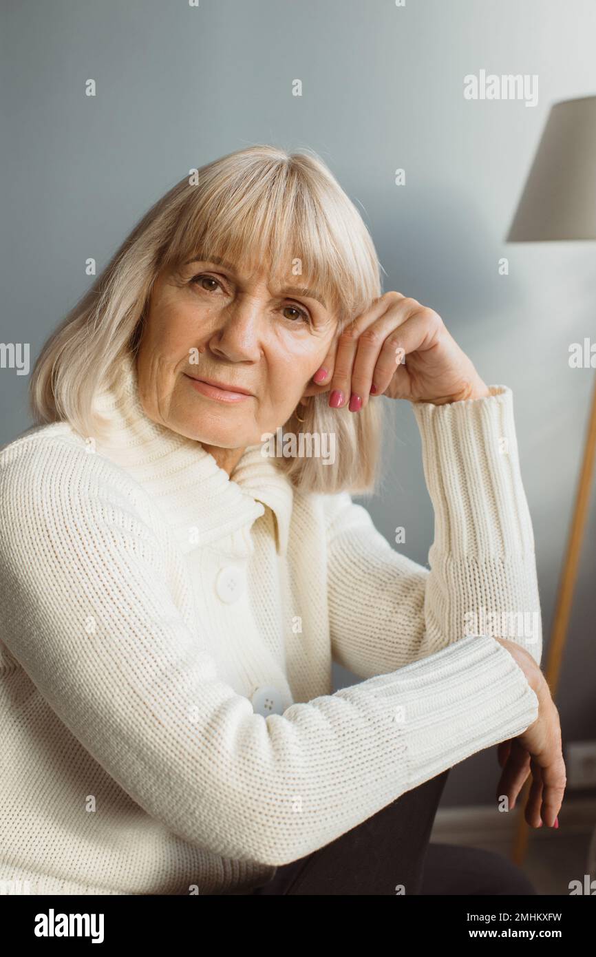 Pretty mid age woman relaxing at home Stock Photo - Alamy