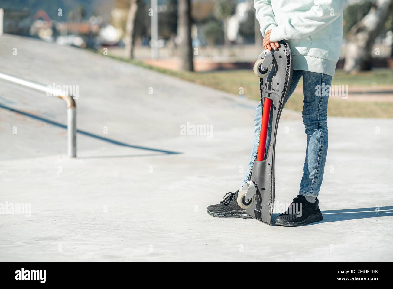 waveboard skater, Girl holds casterboard with two wheels, modern street ...
