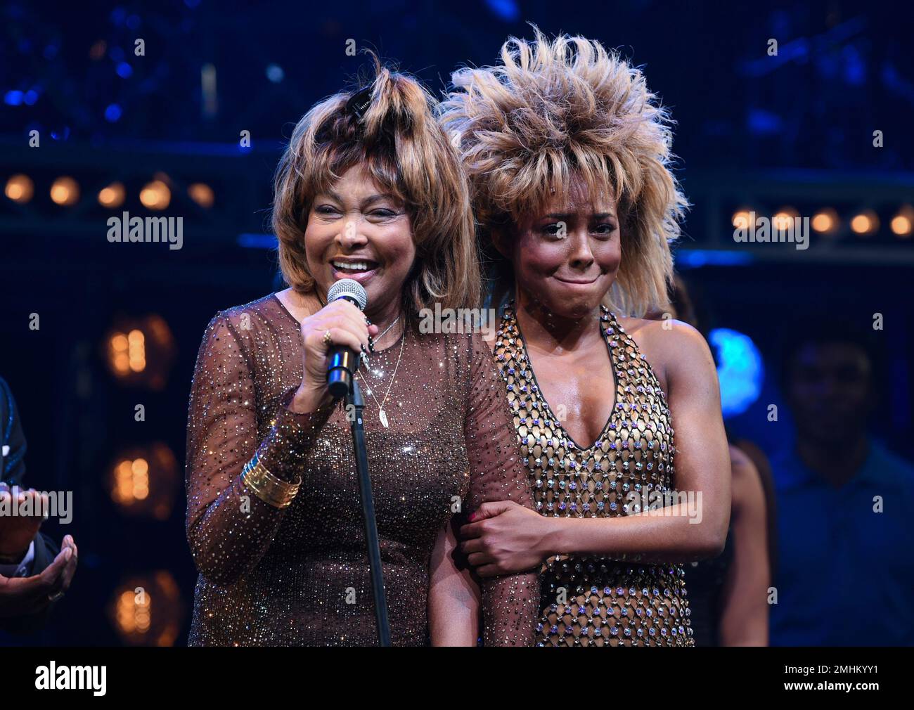 Singer Tina Turner, left, speaks on stage with actress Adrienne Warren ...