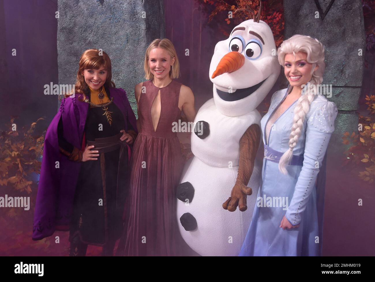 Kristen Bell, second left, poses with characters from the film "Frozen ...