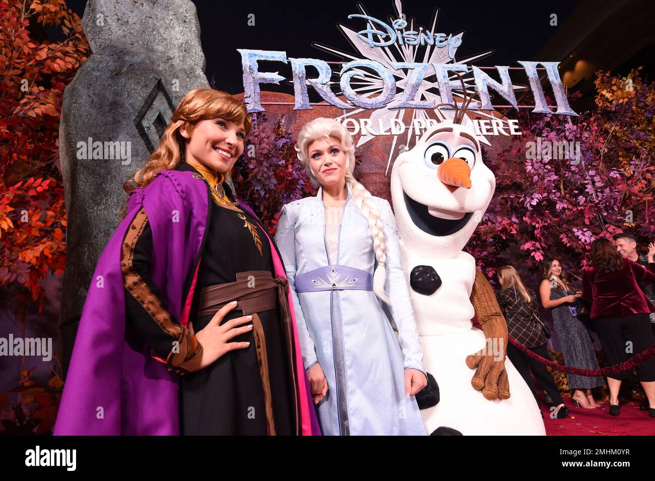 Los Angeles residents Millie Aukee, dressed as Anna, from left, and ...