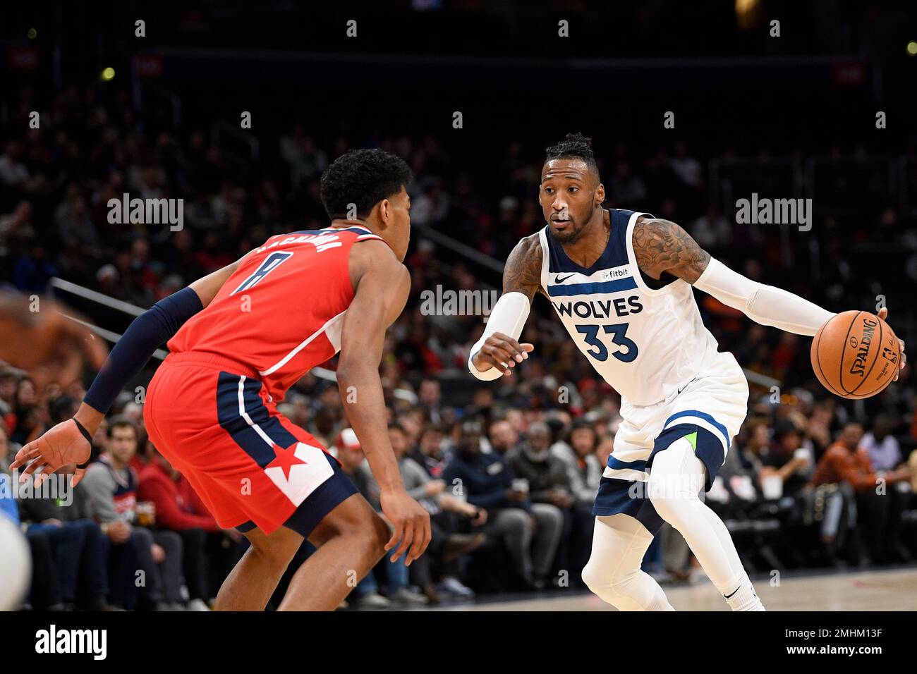 Minnesota Timberwolves forward Robert Covington (33) dribbles the ball ...